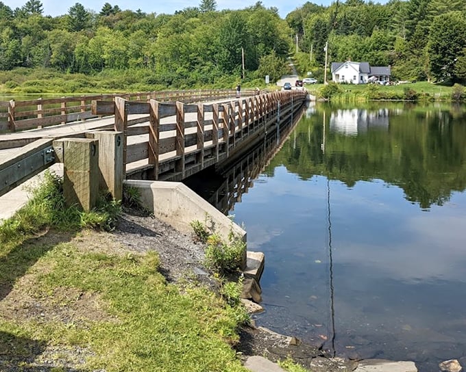 Engineering marvel meets natural beauty where the Floating Bridge connects Brookfield's shores across the pristine waters of Sunset Lake.