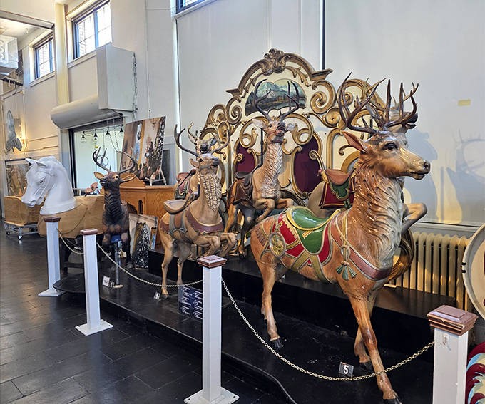 This majestic wooden deer looks ready to leap right off its platform &ndash; antlers polished to perfection for its eternal forest parade.