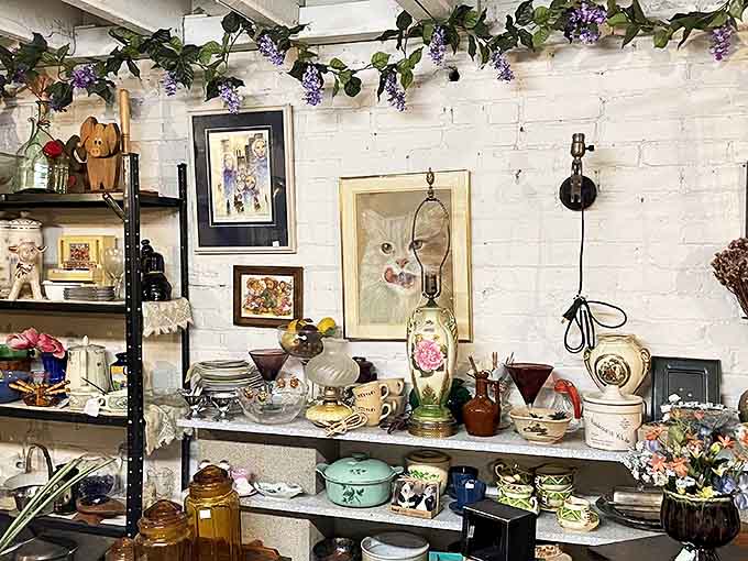 This booth's charming display features whimsical decorative items including artwork that captures feline personality with surprising accuracy &ndash; perfect for the discerning cat enthusiast.