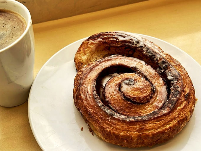 Morning perfection: A coffee companion that's all swirls and twirls. This cinnamon roll isn't just breakfast, it's a hug for your soul.