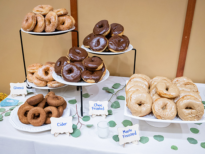 Donut heaven exists! A feast for the eyes with glazed, chocolate-frosted, cider, and maple varieties tempting even the strongest willpower.
