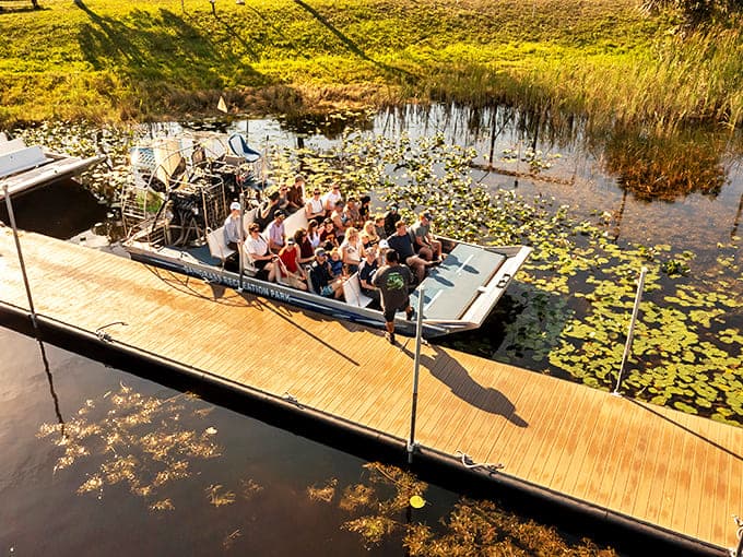 All aboard! Excited visitors prepare to embark on their wetland adventure, blissfully unaware of how windblown their hair photos will look later.