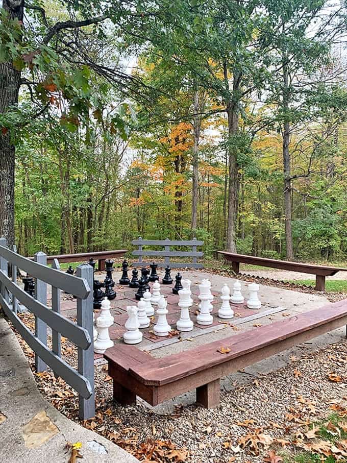 "Your move, forest creatures!" A giant chess set invites strategic thinking under open skies, no wizardry required.