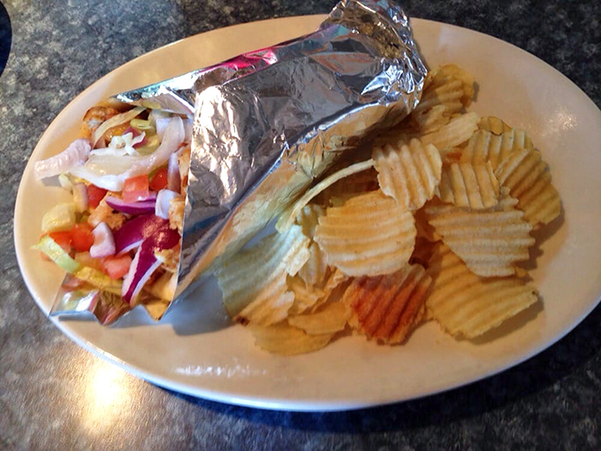 Behold, the gyro of your dreams! Tender meat, crisp veggies, and tzatziki sauce so creamy it could make a Greek god weep with joy.