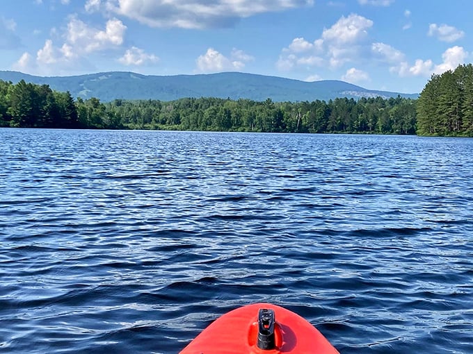 Adventure awaits from the bow of a kayak on Island Pond &ndash; where each paddle stroke takes you deeper into Vermont's pristine wilderness.