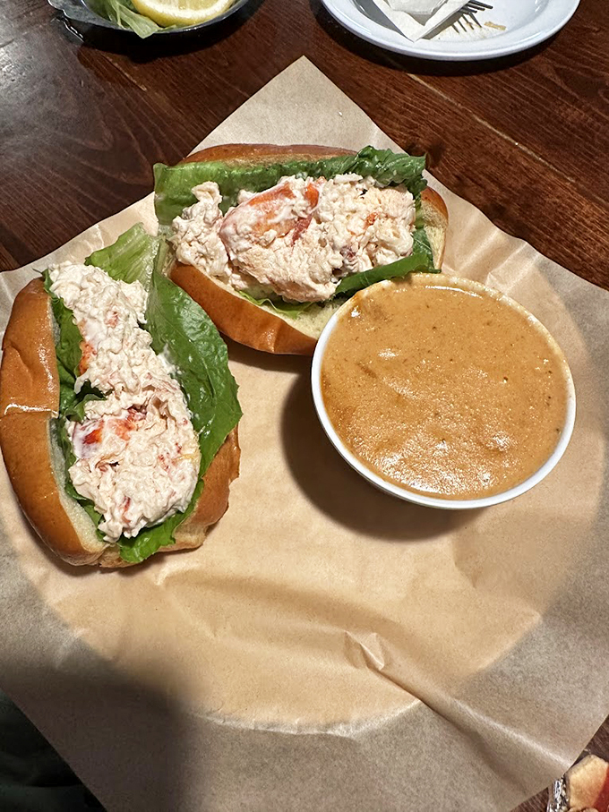 Behold the star of the show! This lobster roll isn't just a sandwich but a vacation between two buns.