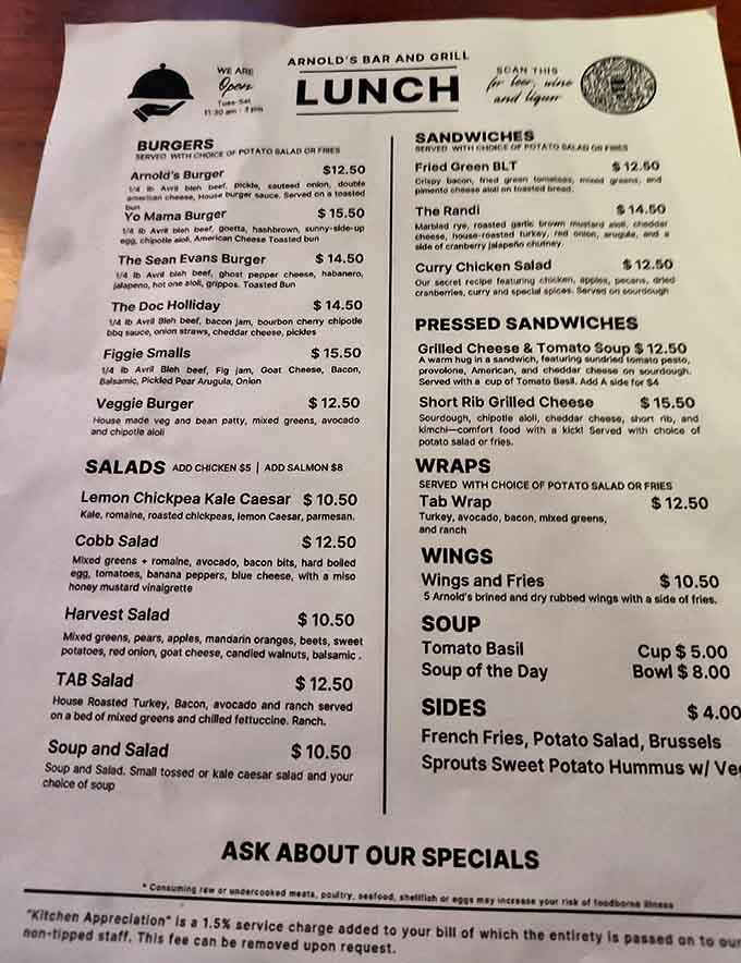 This menu proves that sometimes the best adventures come on laminated paper, featuring everything from Greek Spaghetti to burgers with personality.