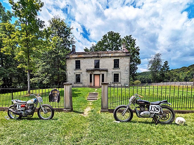 Vintage motorcycles rest against a historic backdrop, creating a delightful anachronism that makes you wonder if time travelers got their centuries mixed up.