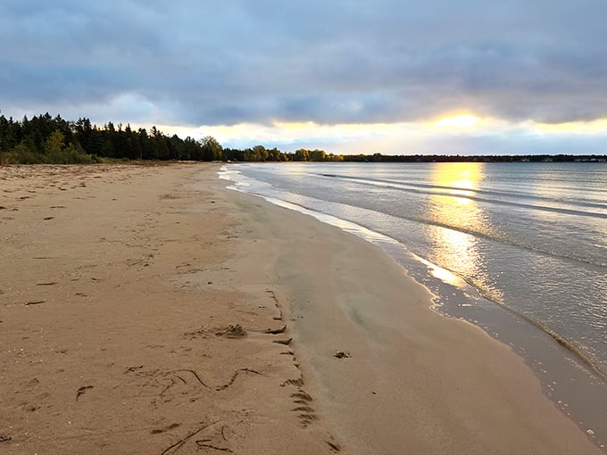 Golden hour transforms this pristine beach into a painter's dream, with gentle waves creating nature's soundtrack along the shoreline.