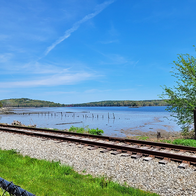 Where railroad tracks meet waterways &ndash; Wiscasset's natural beauty unfolds along the Sheepscot River, offering tranquility just steps from downtown.