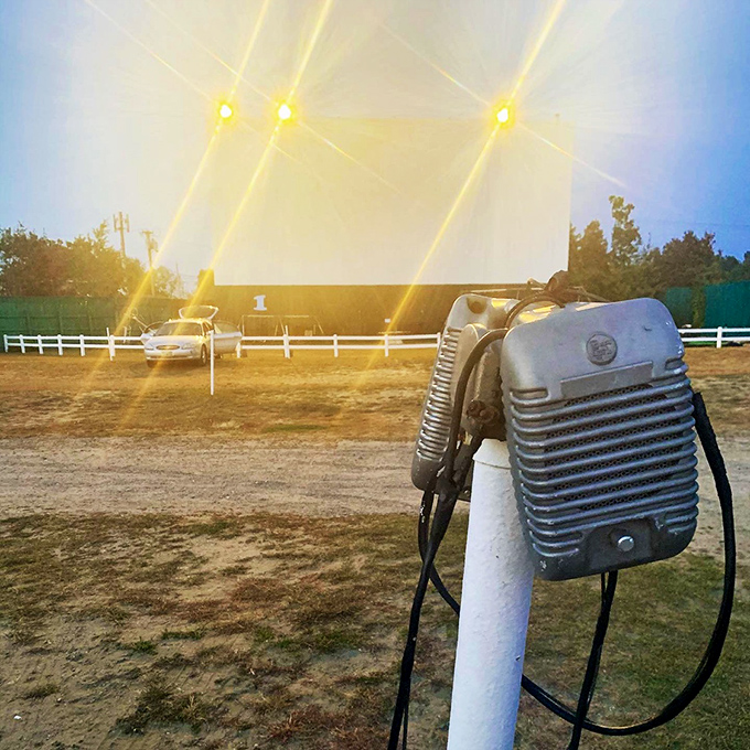 These vintage speakers stand as charming relics of drive-in history, though modern visitors now tune their car radios for crystal-clear sound.