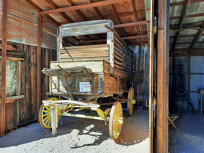This yellow-wheeled wagon once carried hopes, dreams, and supplies across the unforgiving desert. Now it rests, its journeys complete.