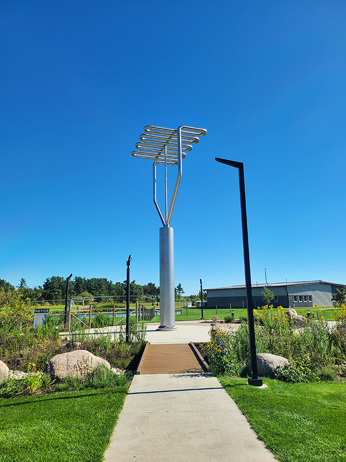 A thoughtfully designed walkway leads visitors through native prairie plantings to this unexpected monument celebrating farming heritage and fun.