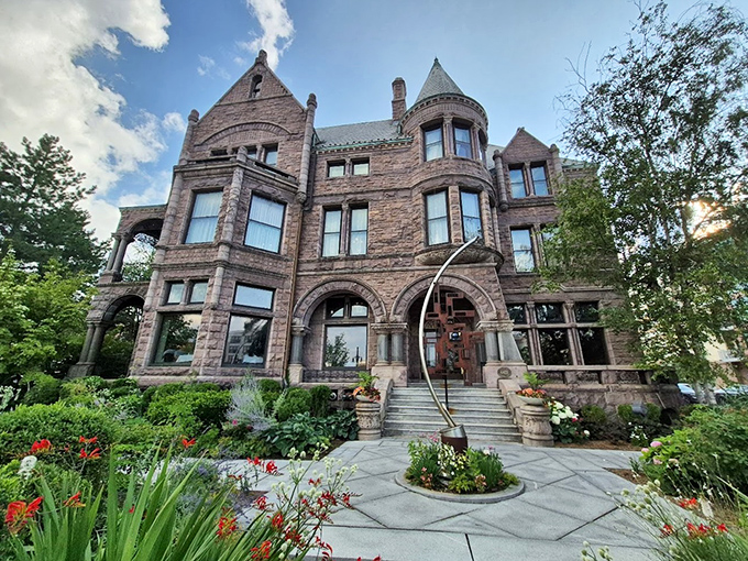 The Whitney's grand brownstone facade showcases the incredible craftsmanship of Detroit's gilded age architecture.