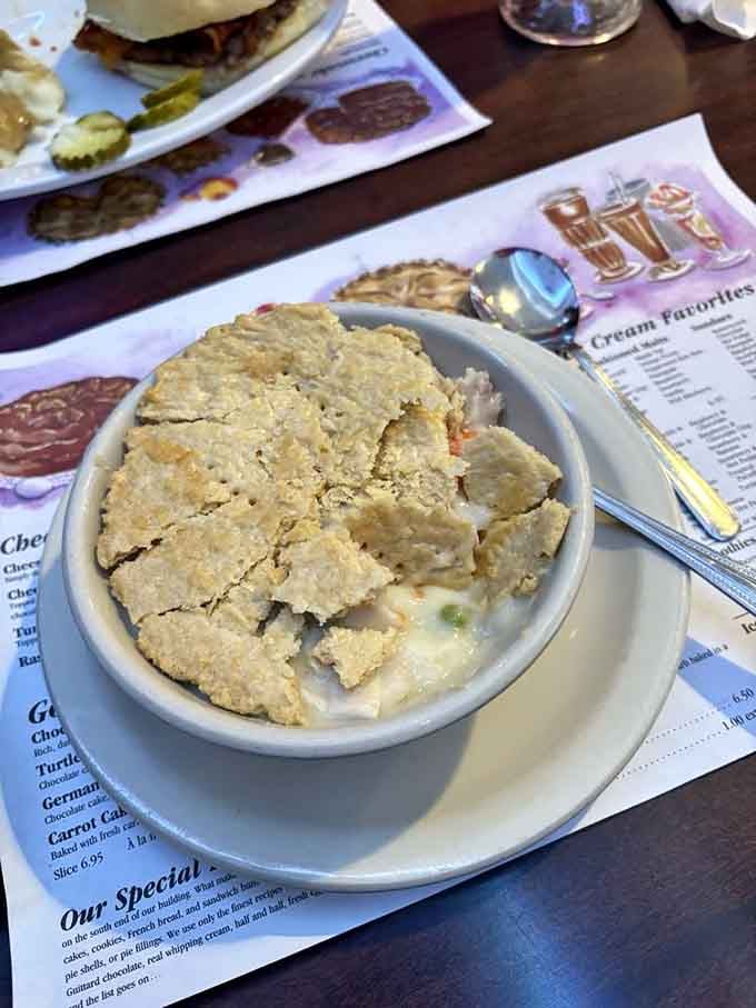 Behold the star of the show: golden-crusted pot pie filled with tender chicken and vegetables in creamy gravy that'll warm your soul.