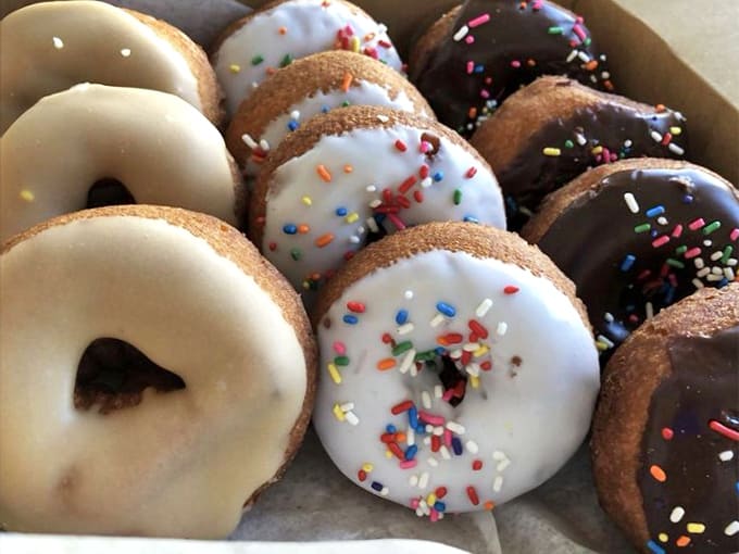 A rainbow of cake donuts that look like they're auditioning for the role of "Best Part of Your Morning."