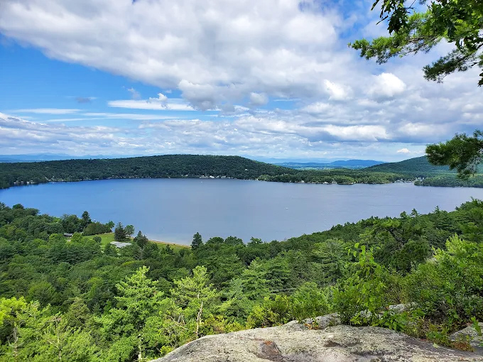 From above, Lake Dunmore reveals its crystal-clear waters embraced by Vermont's lush forest landscape.