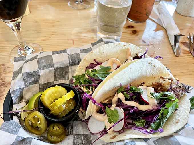 Fish tacos loaded with slaw and pickled jalape&ntilde;os, because Lake Superior knows how to do coastal cuisine inland.