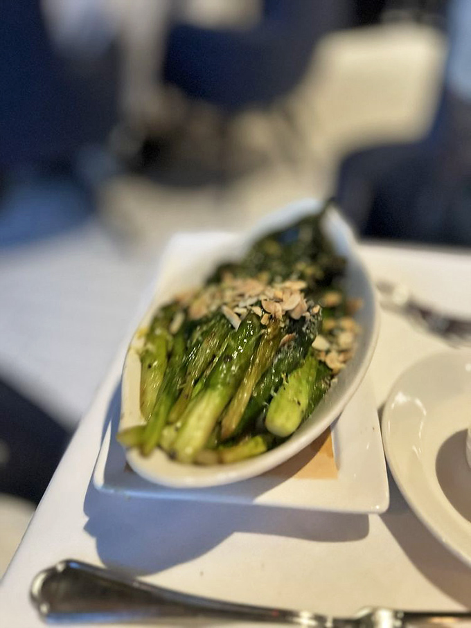 Simple yet sublime &ndash; wood-grilled asparagus spears glisten with a light touch of seasoning, proving vegetables can steal the spotlight.