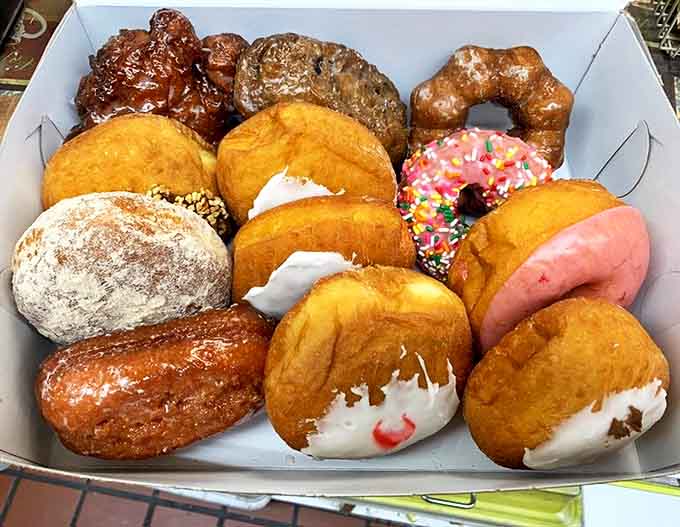 A box of assorted donuts reveals the artistry behind these humble treats &ndash; each one handcrafted with the perfect balance of sweetness and substance.