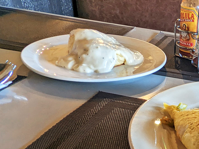 Behold the holy grail of comfort food: biscuits smothered in creamy, peppery gravy that would make your grandmother weep with pride.