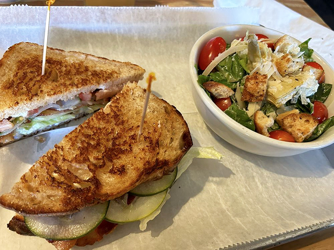 The legendary BLT sandwich arrives with golden toast, crisp lettuce, and bacon that makes you question all other bacon you've encountered before.