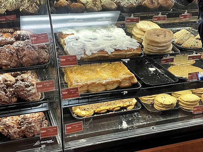 Fresh-baked pastries glisten behind glass, each one promising a moment of sweet escape from highway monotony.