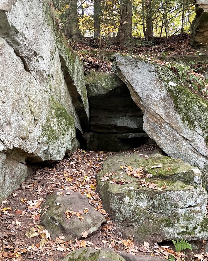 Nature's doorway beckons explorers through this rocky passage, where adventure waits just beyond the stone threshold.