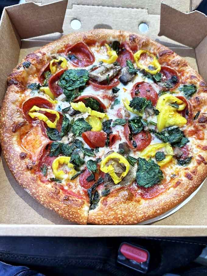 A proper New York slice demands the fold technique, with toppings that complement rather than overwhelm that perfect thin-yet-chewy crust.