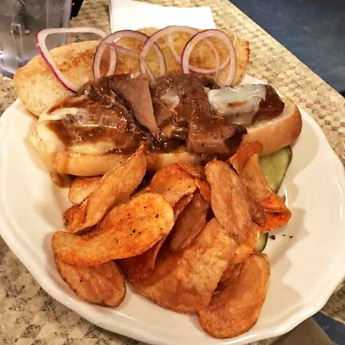 This isn't just a sandwich—it's a brisket revelation on French bread that makes you wonder if they've secretly imported a New Orleans chef.