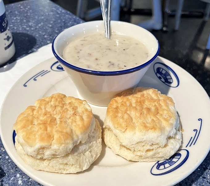 These cloud-like biscuits smothered in peppery gravy might be the most compelling reason to get up early &ndash; comfort food that defies gravity.