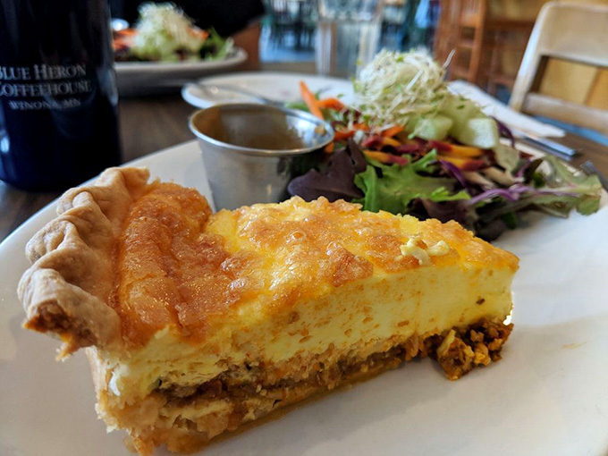 Behold the golden-topped glory that is Blue Heron's quiche, served with a side salad that's actually worth eating instead of pushing around your plate.