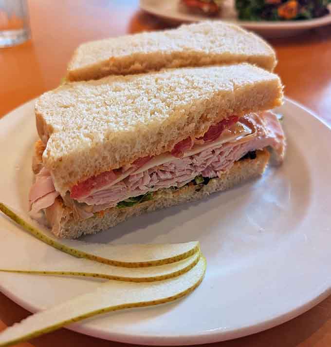 This turkey sandwich stacks up like a delicious Jenga tower, complete with fresh veggies and bread that actually tastes like something special.