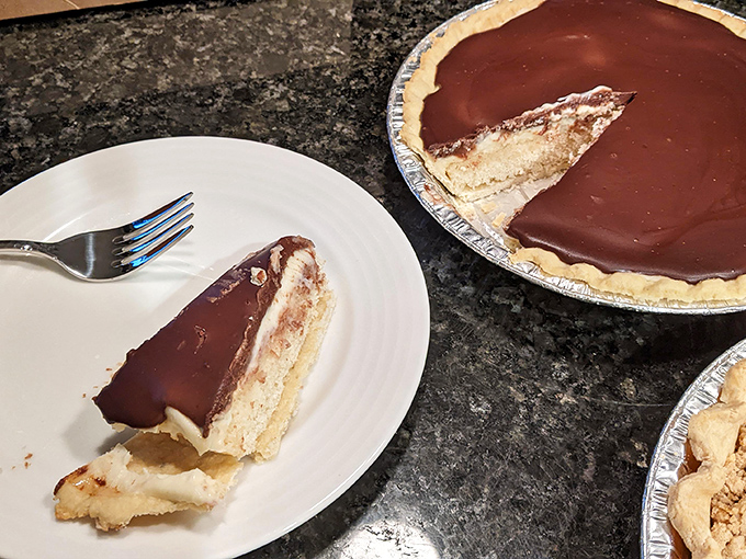 Chocolate ganache so glossy you could check your reflection before diving into that pillowy cream filling. Boston cream perfection!