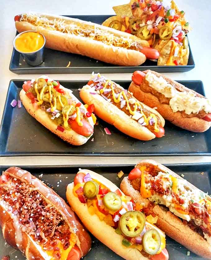 These aren't just hot dogs &ndash; they're edible art forms topped with everything from jalape&ntilde;os to chili, each one a flavor adventure.