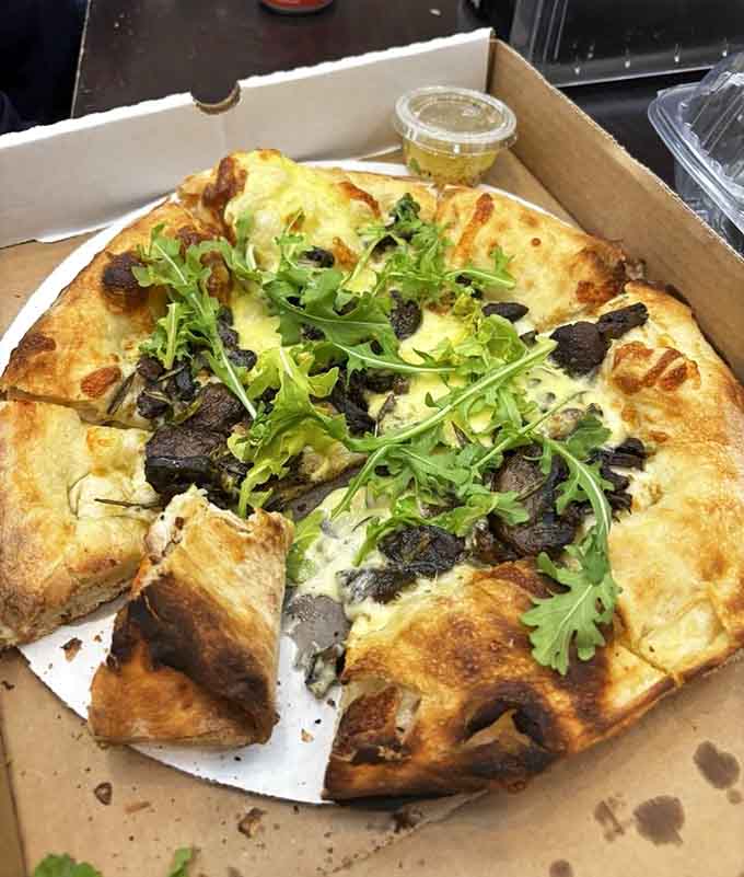 Topped with wild mushrooms, brie, and fresh arugula, this pizza proves that sometimes the fanciest combinations are also the most crave-worthy.