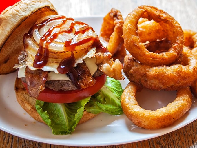 Burger nirvana achieved! This masterpiece with crispy onion rings might just ruin all other burgers for you.