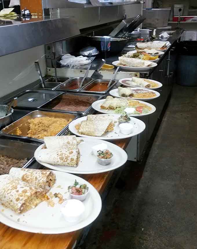 Burritos: The kitchen assembly line where dreams are wrapped in tortillas. Each plate represents hours of tradition and technique.