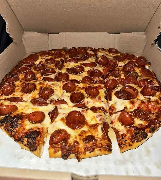 Behold the pepperoni pizza in all its glory, with those perfectly crisped edges of meat creating little cups of deliciousness.