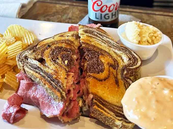 The legendary Reuben sandwich arrives in all its glory &ndash; a towering masterpiece of tender corned beef, melted Swiss, and tangy sauerkraut on perfectly grilled marble rye.