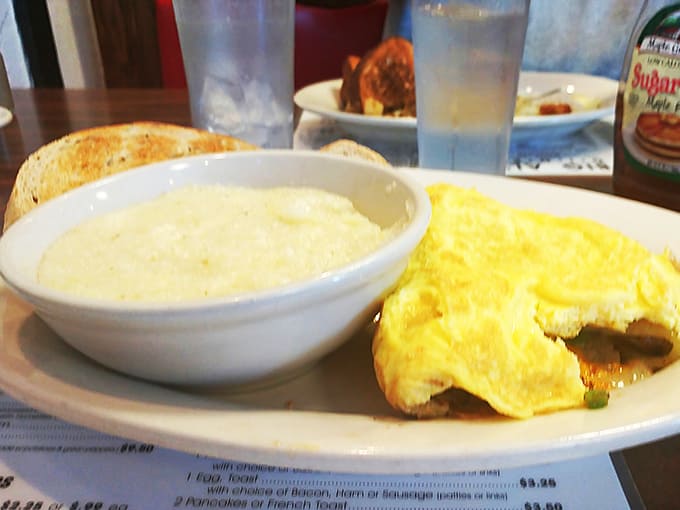 These aren't just any grits &ndash; they're a monument to proper cheese, ready to challenge your jaw's capacity.
