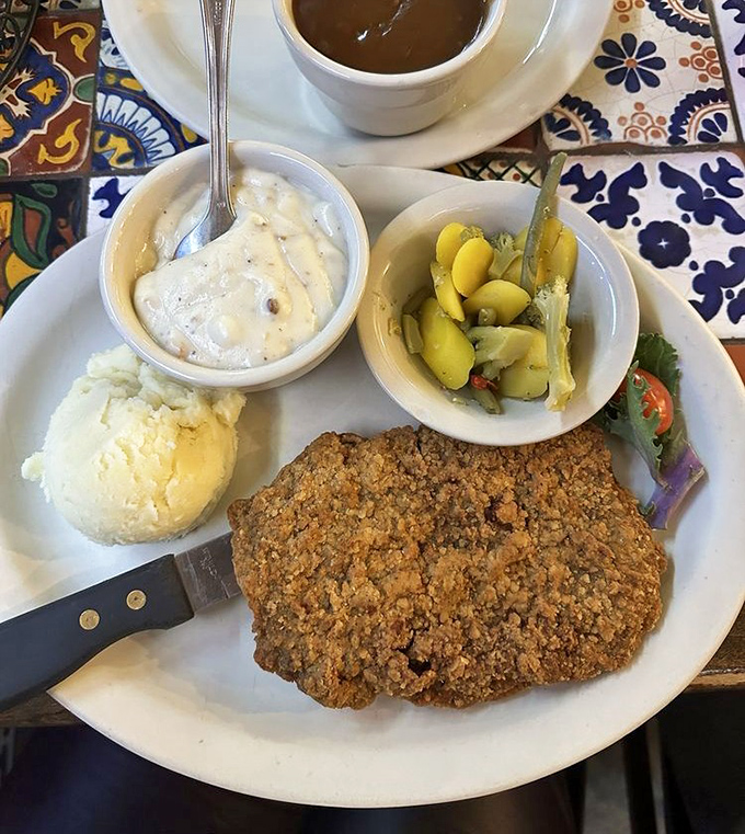 Golden-brown perfection on a plate &ndash; this chicken fried steak achieves the holy trinity of crispy coating, tender meat, and peppery gravy that'll haunt your dreams.