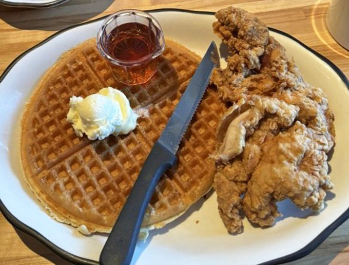 The holy matrimony of crispy fried chicken and fluffy waffle, blessed with maple syrup and a dollop of whipped butter.