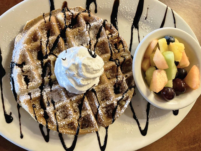 Chocolate-drizzled Waffle: This Belgian beauty arrives like a morning masterpiece &ndash; crisp exterior, fluffy interior, and chocolate drizzle playing visual jazz across the plate.
