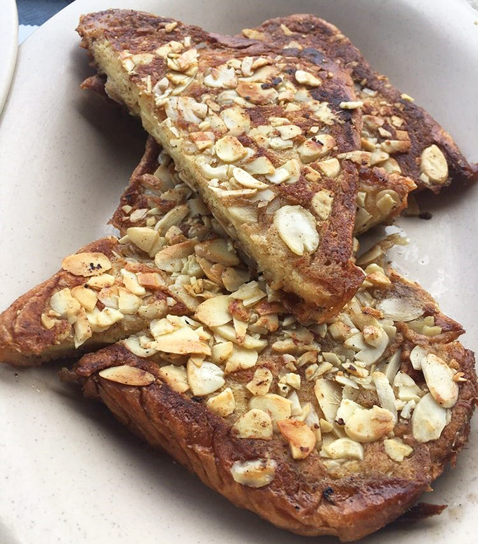 Behold the crown jewel! Golden-brown perfection topped with toasted almonds that add nutty crunch to every heavenly bite.