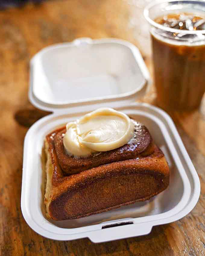 This cinnamon roll doesn't mess around, delivering swirls of cinnamon-sugar joy topped with generous frosting that'll haunt your dreams.