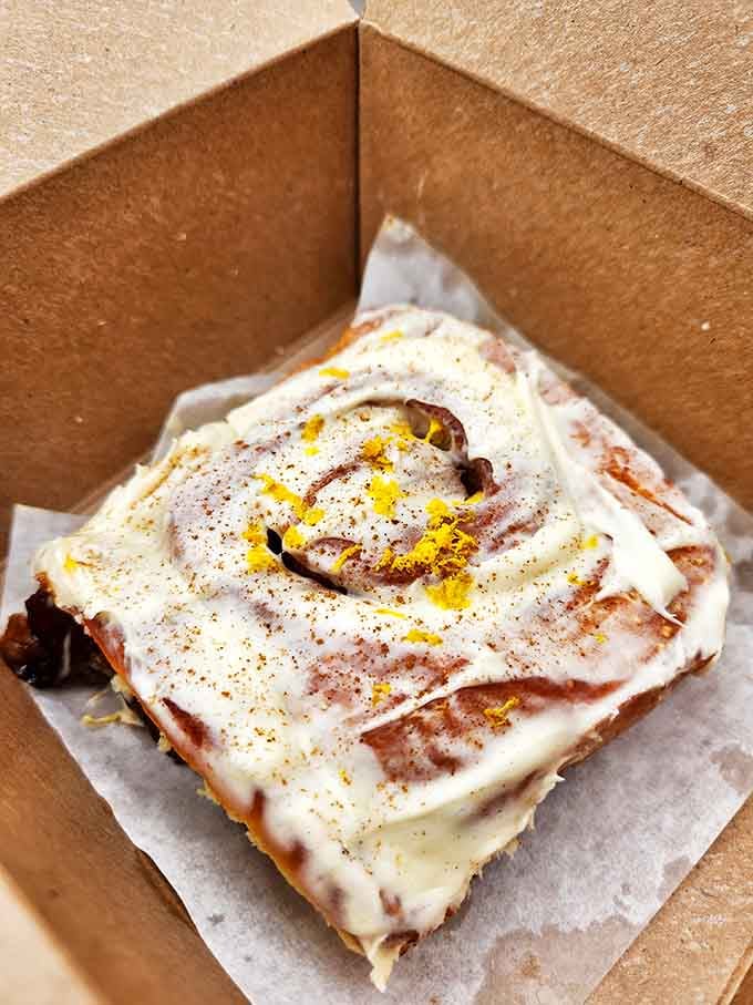 The legendary cinnamon roll in all its glory &ndash; a spiral masterpiece of dough, cinnamon, and icing that's worth every single calorie.
