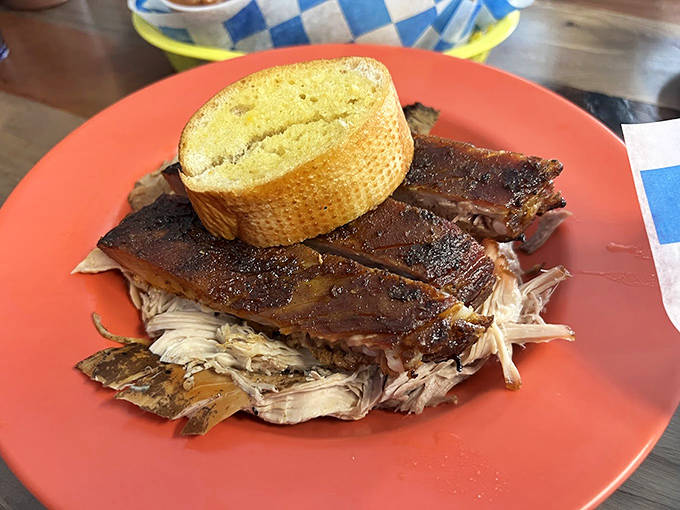 Pulled pork perfection on a plate &ndash; tender strands of 13-hour smoked meat alongside golden cornbread that demands to be devoured.