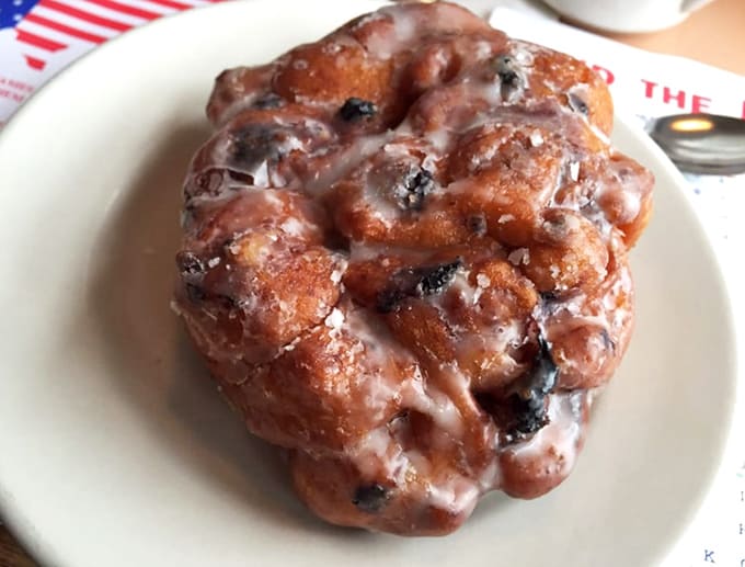 Behold the blueberry fritter in all its glory, studded with Maine's finest berries and glistening with sweet glaze.