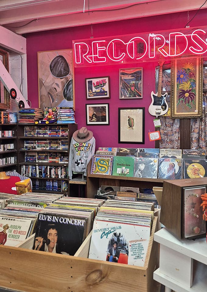 Records: Vinyl enthusiasts, prepare to lose track of time! Under that glowing neon sign, thousands of albums wait for their next spin on your turntable.